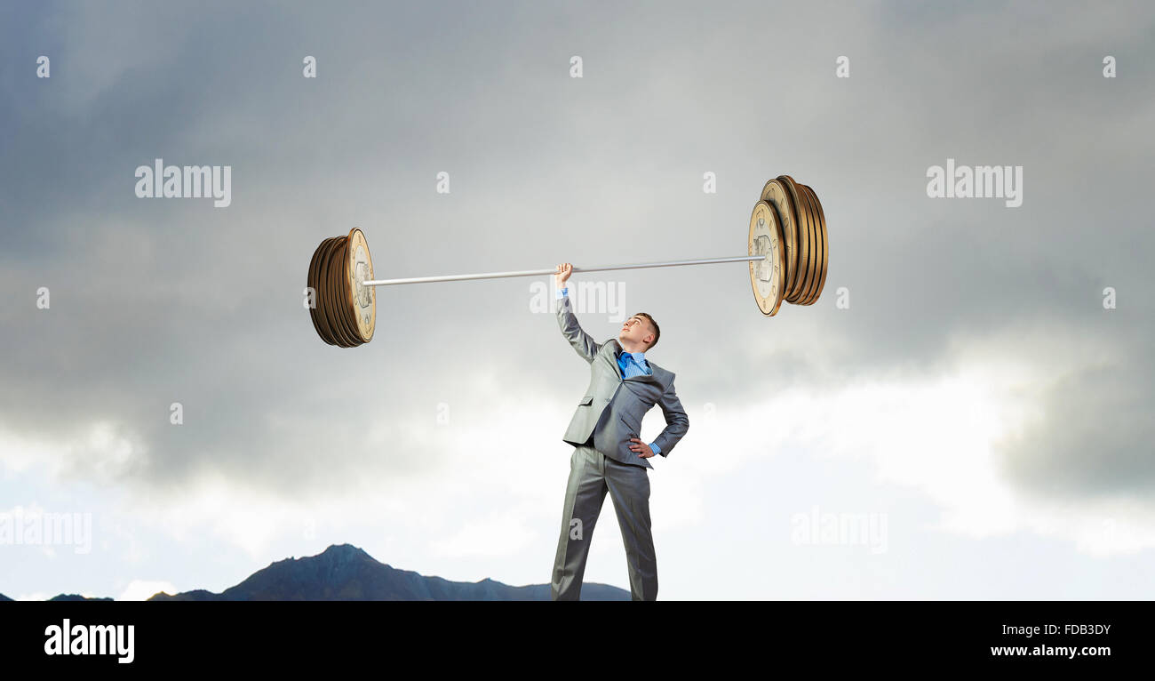 Confident businessman lifting above head barbell made of coins Stock ...