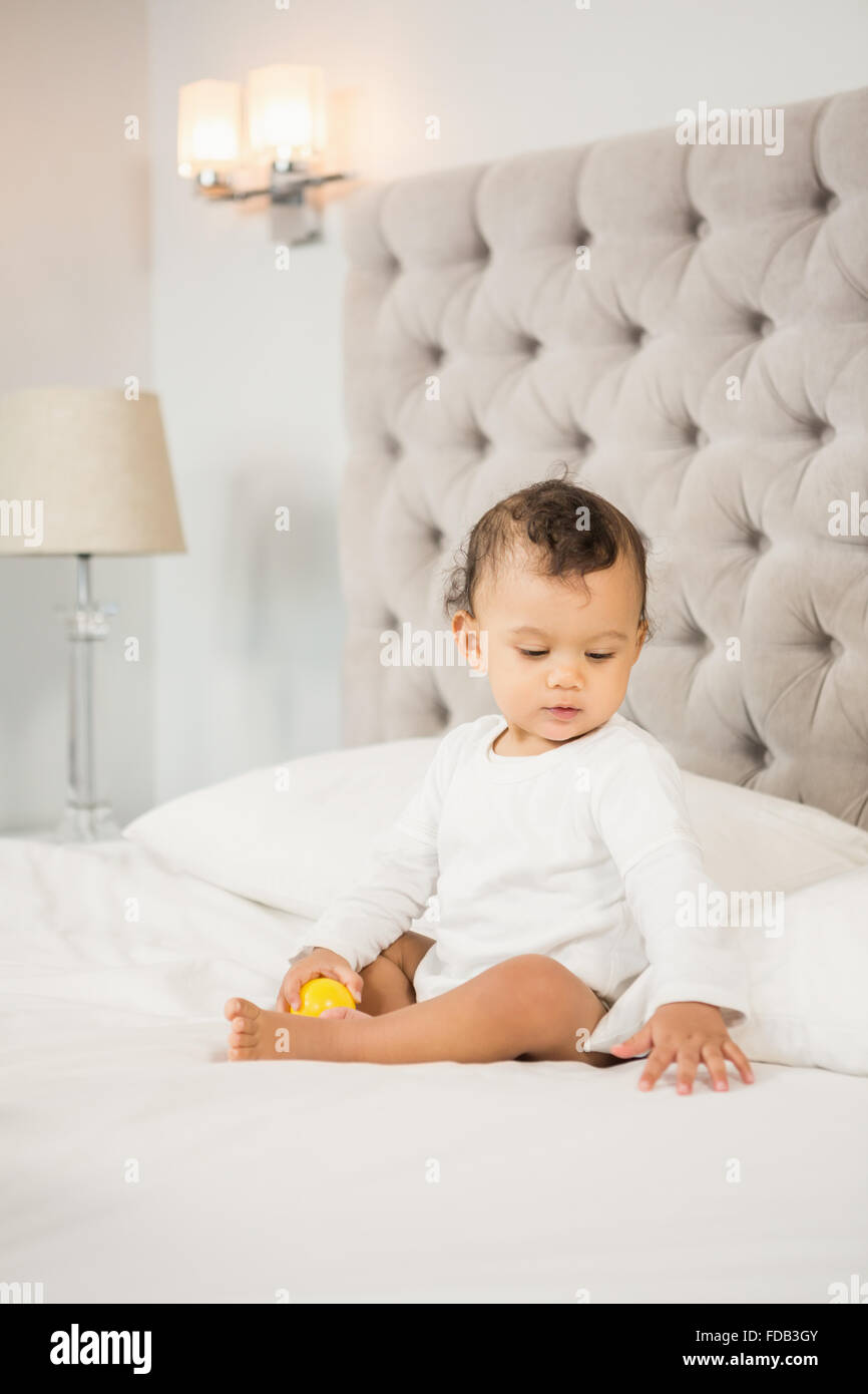 Cute baby playing with ball Stock Photo - Alamy