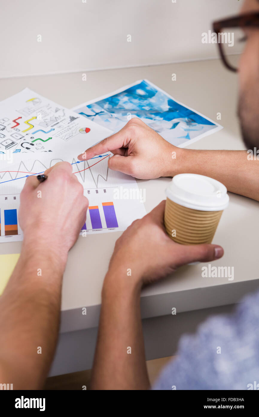 Two men showing graph Stock Photo - Alamy