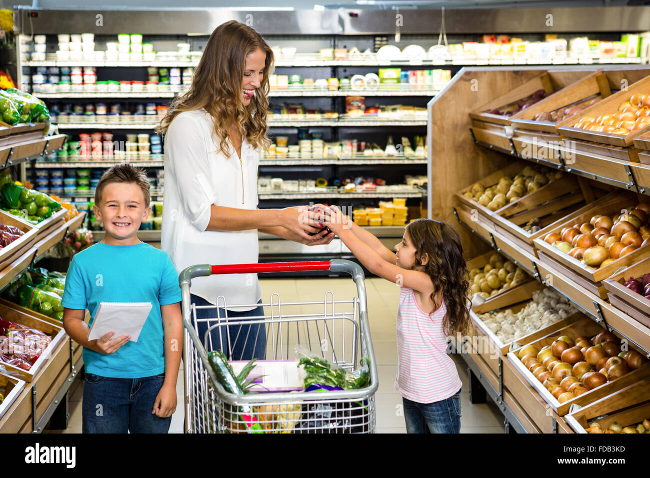 Happy family doing shopping Stock Photo - Alamy