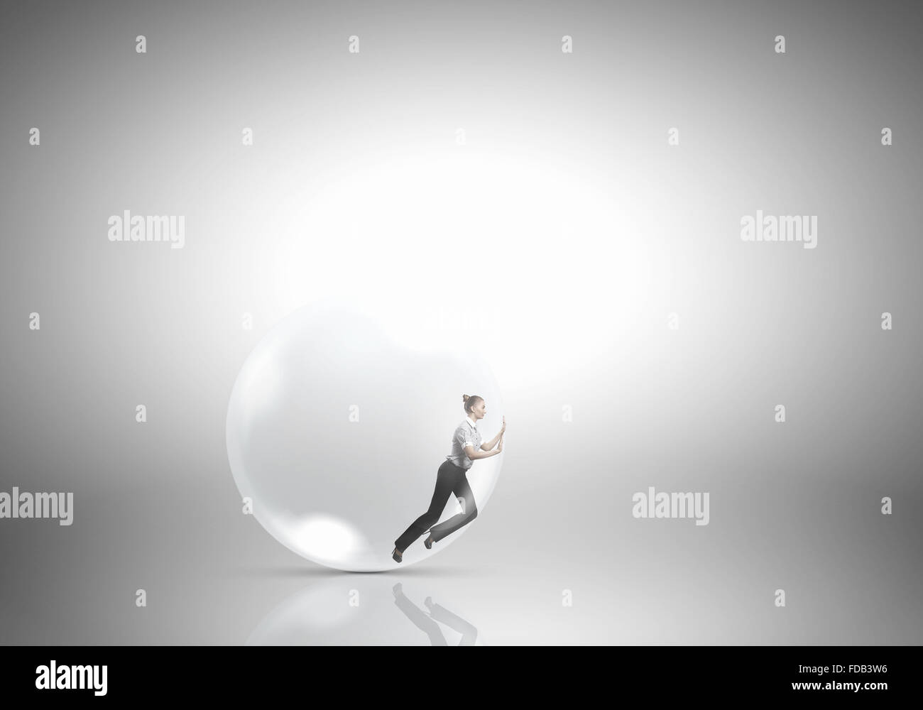 Young businesswoman trying to get out of soap bubble Stock Photo - Alamy