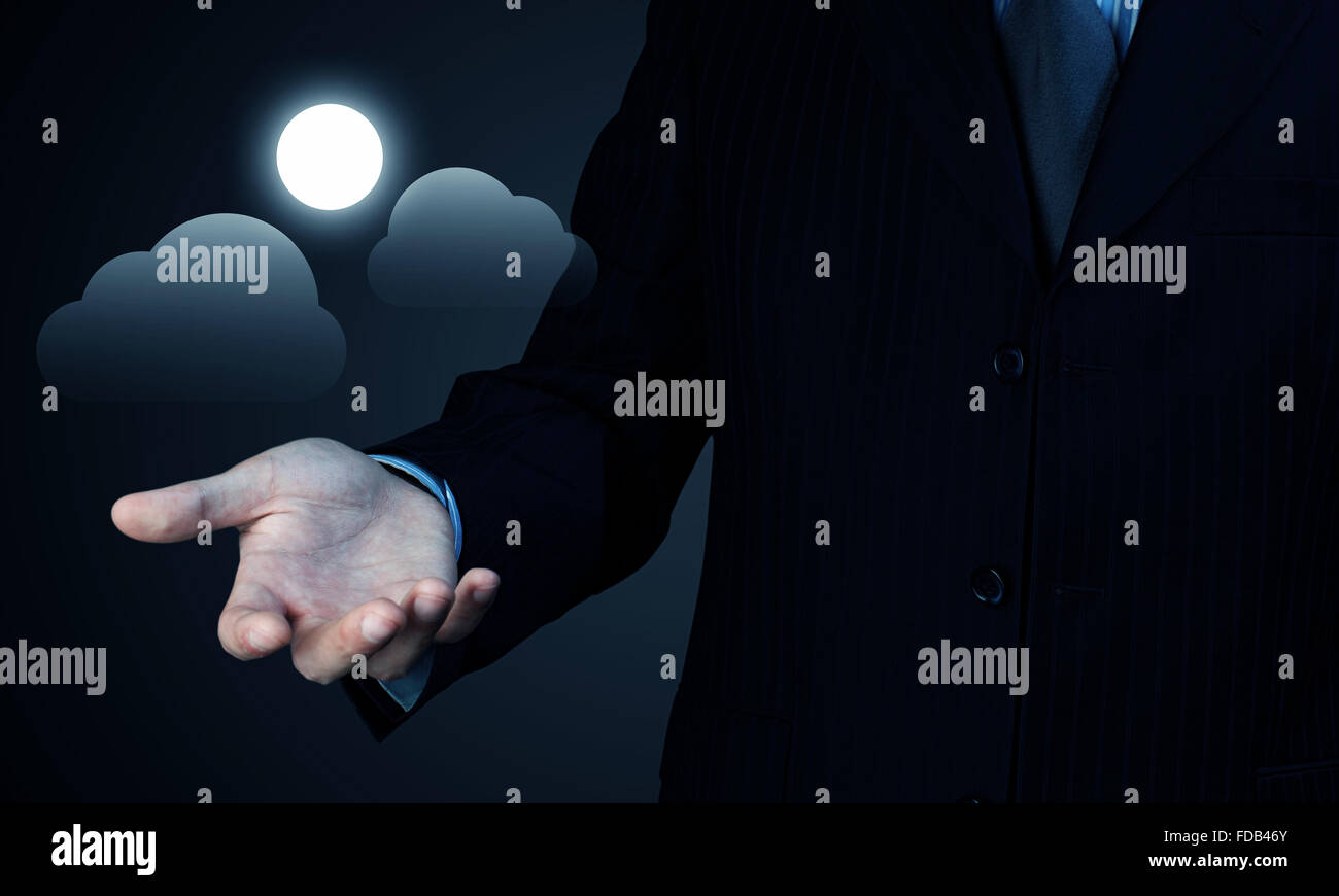 Hand of businessman holding in hand cloud sign Stock Photo - Alamy