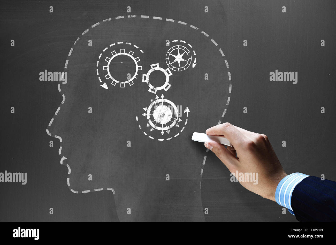 Businessman hand drawing with chalk gears mechanism as teamwork concept ...