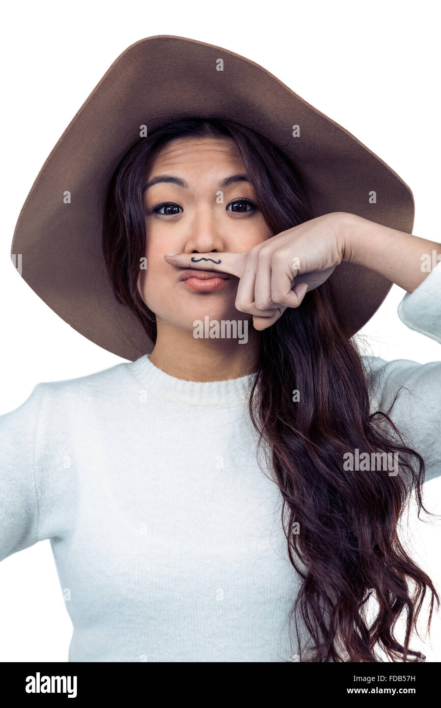 Asian woman with mustache on finger posing for the camera Stock Photo ...