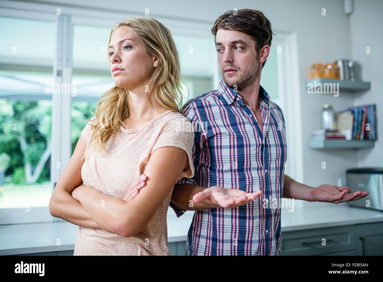 Upset couple having an argument Stock Photo - Alamy