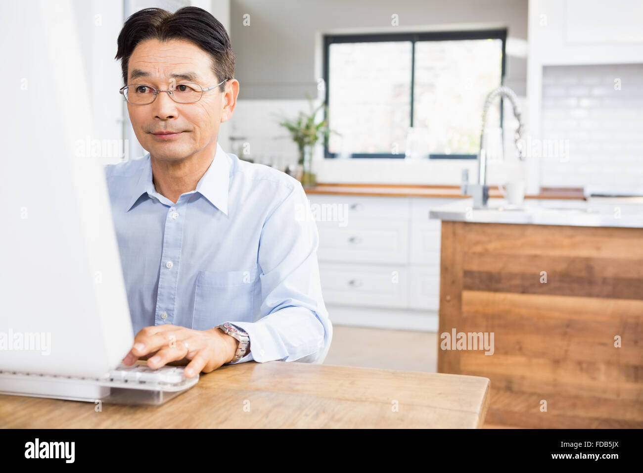 Concentrated man using computer Stock Photo - Alamy