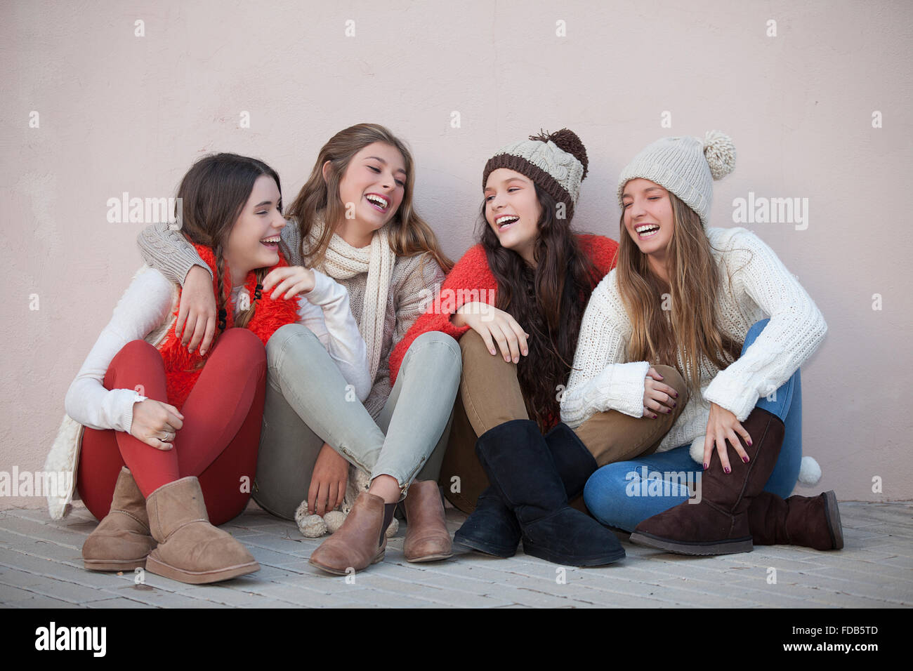 group of trendy happy teens smiling and laughing Stock Photo - Alamy