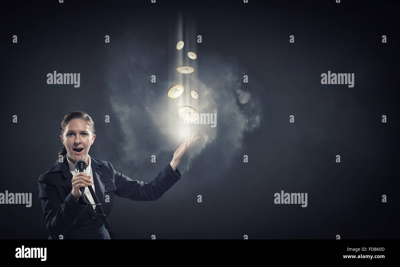 Woman reporter with microphone gesturing with hand Stock Photo - Alamy