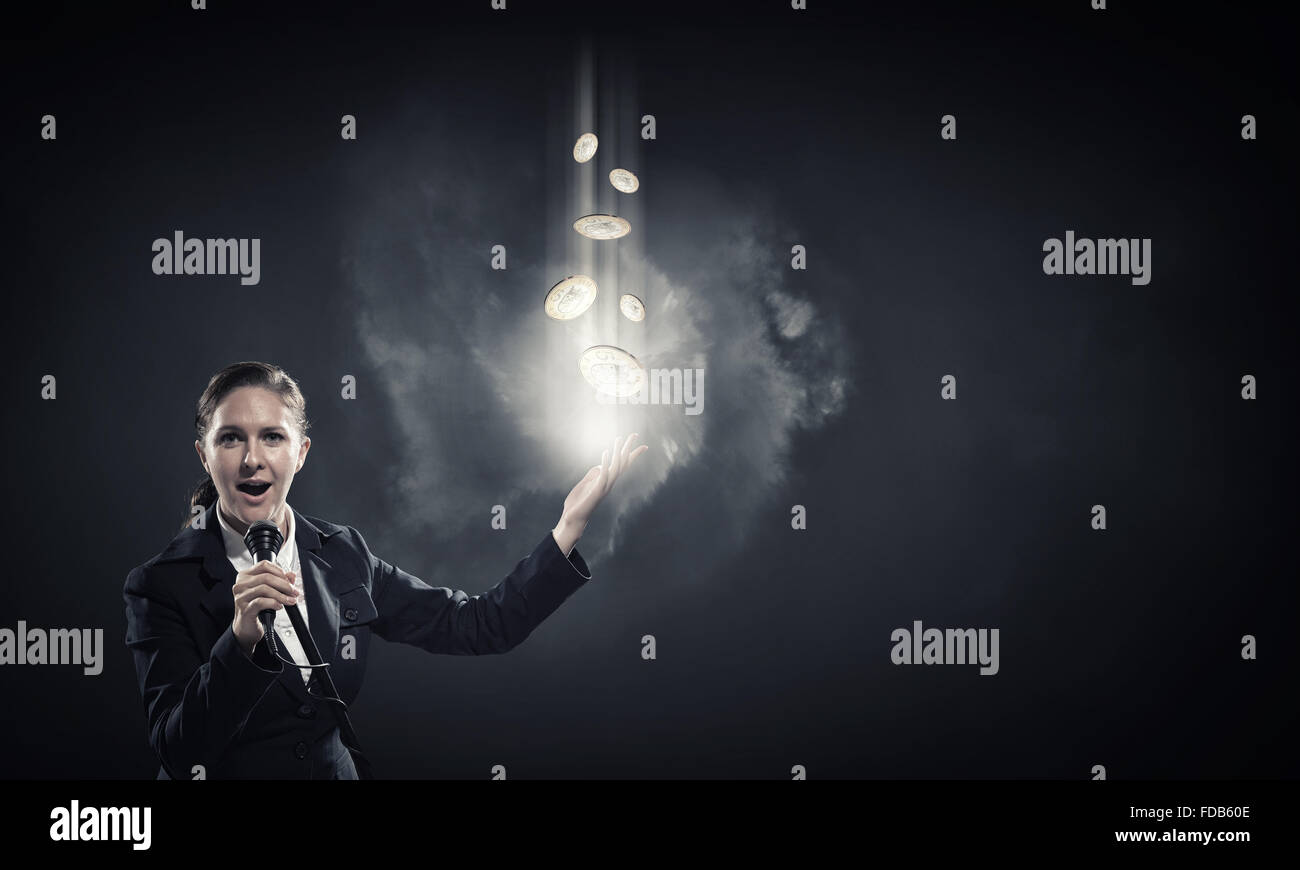 Woman reporter with microphone gesturing with hand Stock Photo - Alamy