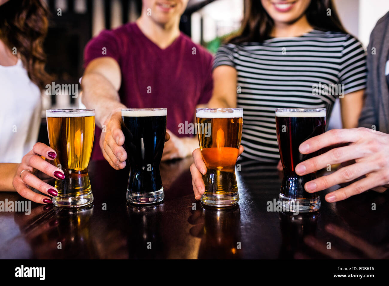 Friends having a pint Stock Photo - Alamy