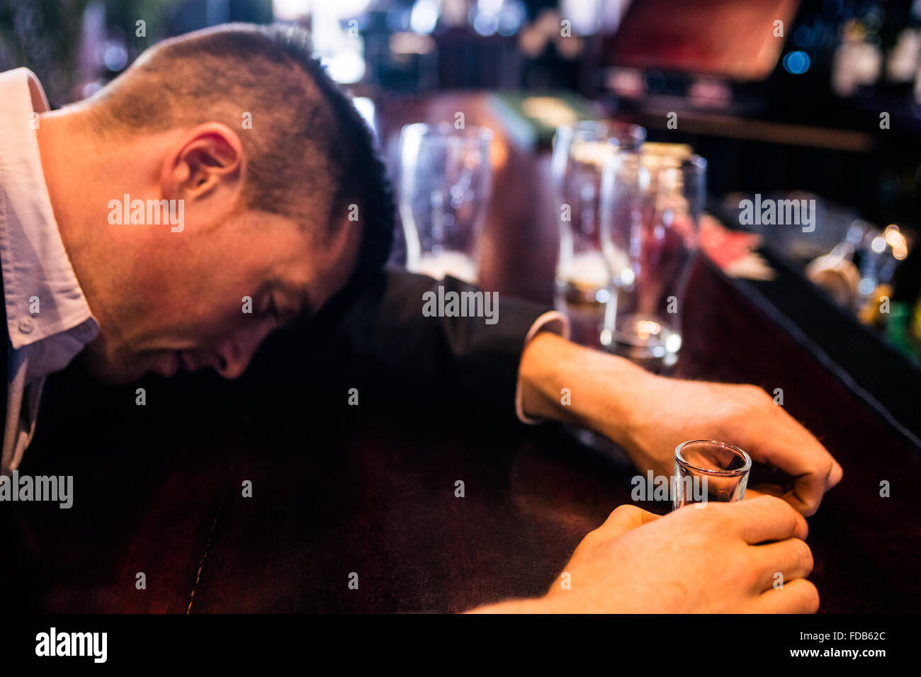 Drunk man having a shooter Stock Photo - Alamy
