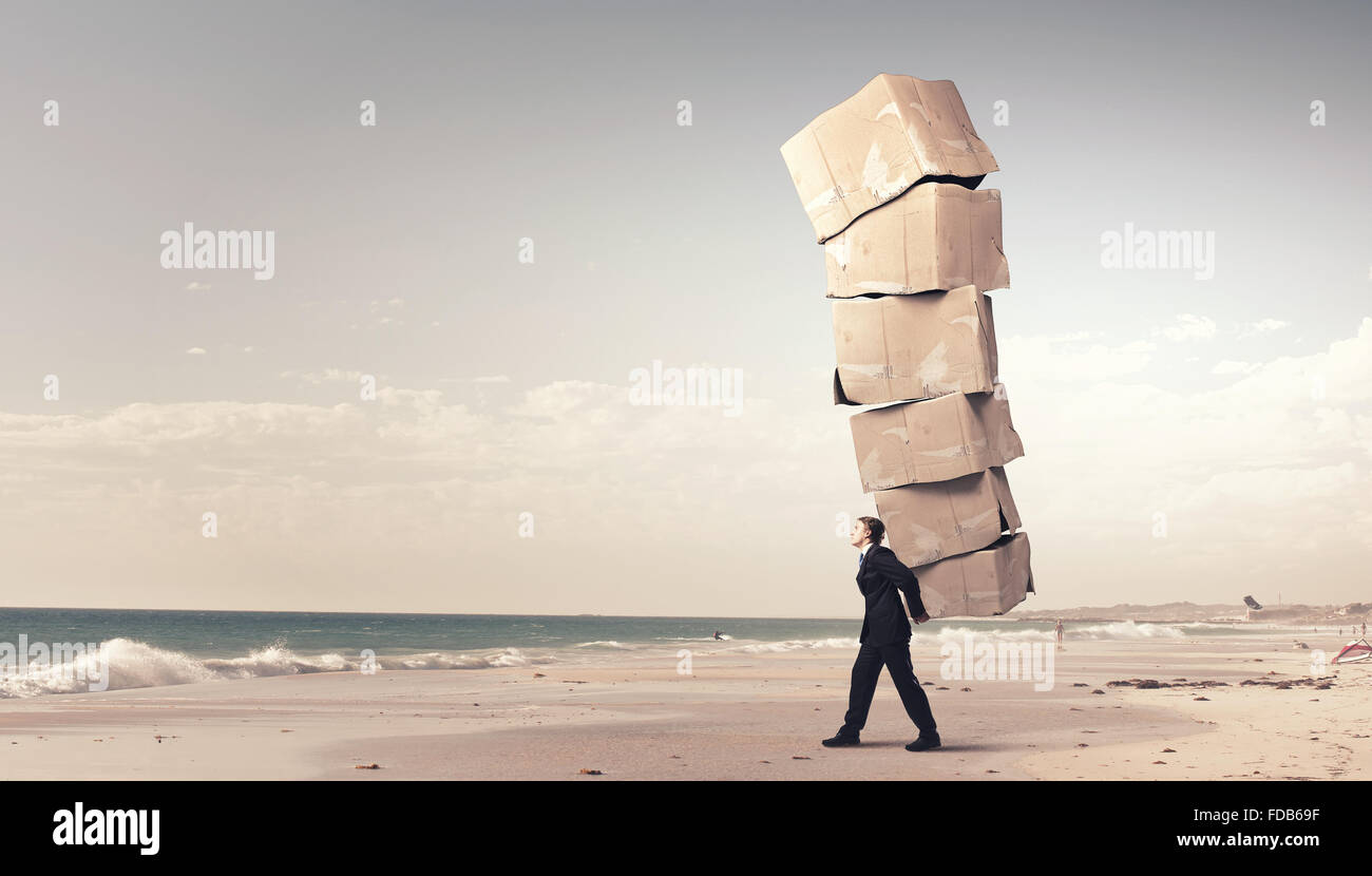 Businessman carrying big stack of carton boxes Stock Photo - Alamy