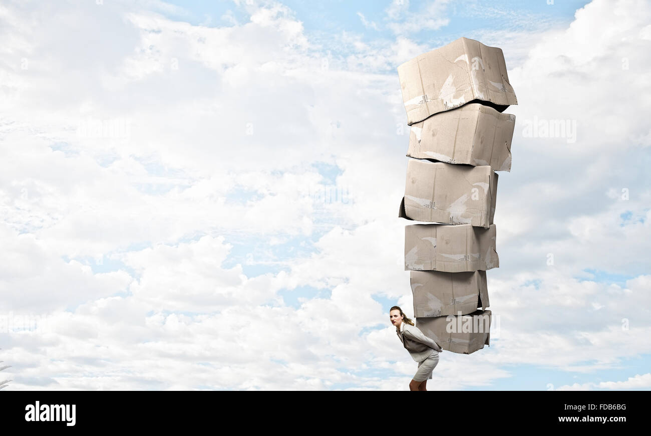 Businesswoman carrying big stack of carton boxes Stock Photo - Alamy