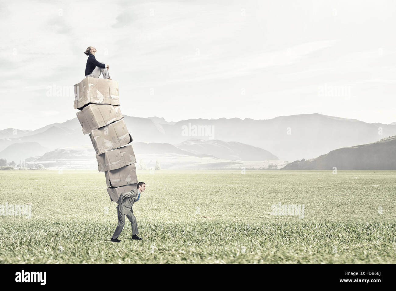 Businessman carrying big stack of carton boxes Stock Photo - Alamy