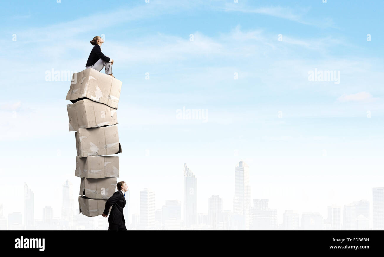 Businessman carrying big stack of carton boxes Stock Photo - Alamy