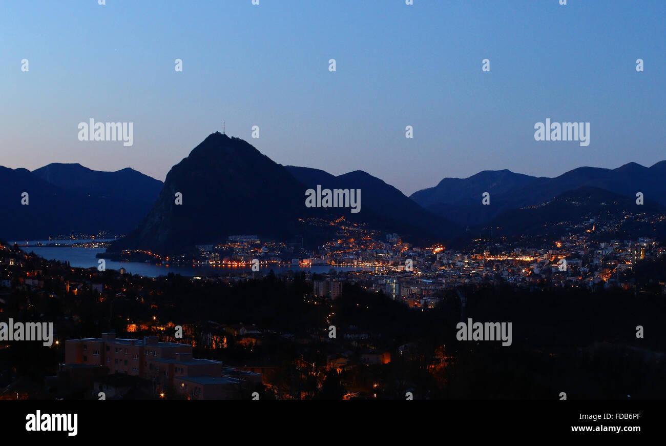 The bay of Lugano at night with Mount San Salvatore Stock Photo - Alamy