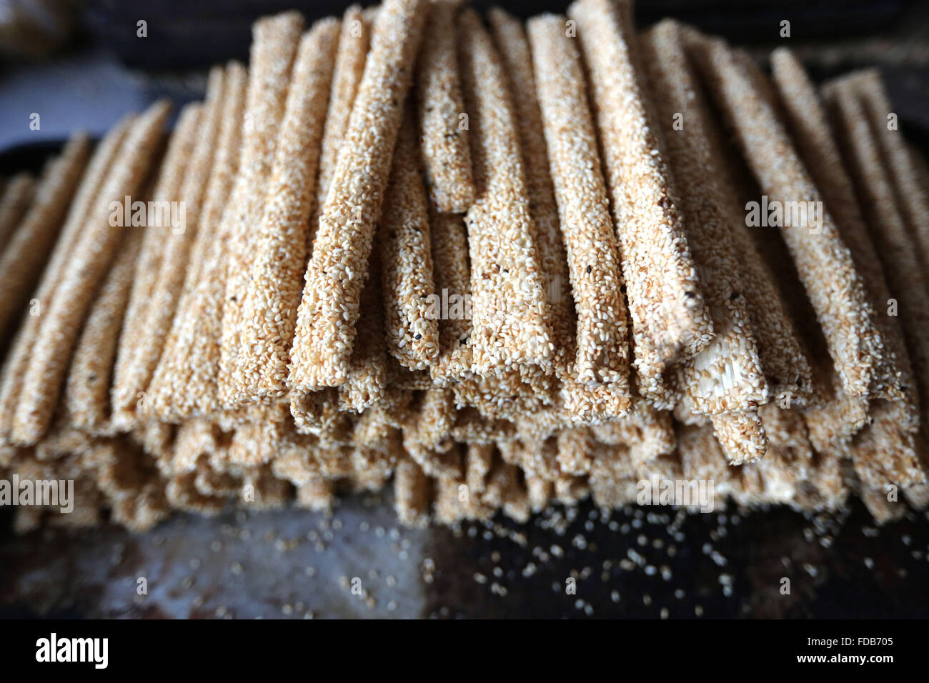 Anyang, Anyang, CHN. 30th Jan, 2016. The process of sesame candy ...