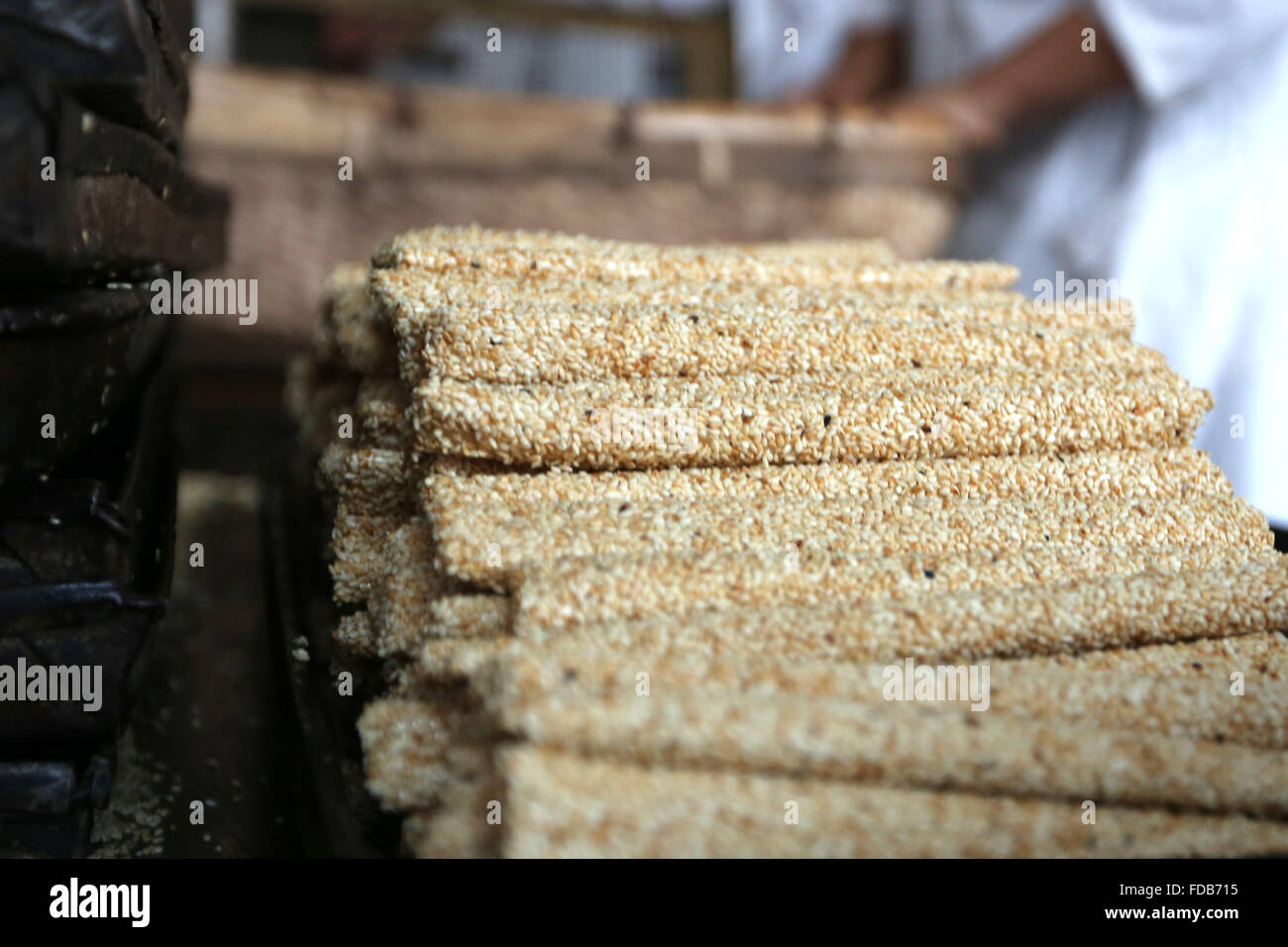 Anyang, Anyang, CHN. 30th Jan, 2016. The process of sesame candy ...