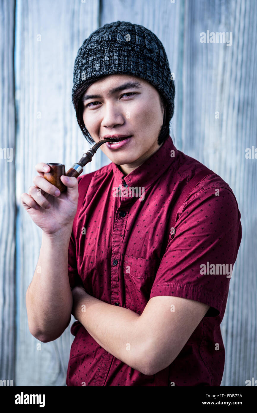 Hipster smoking pipe Stock Photo - Alamy