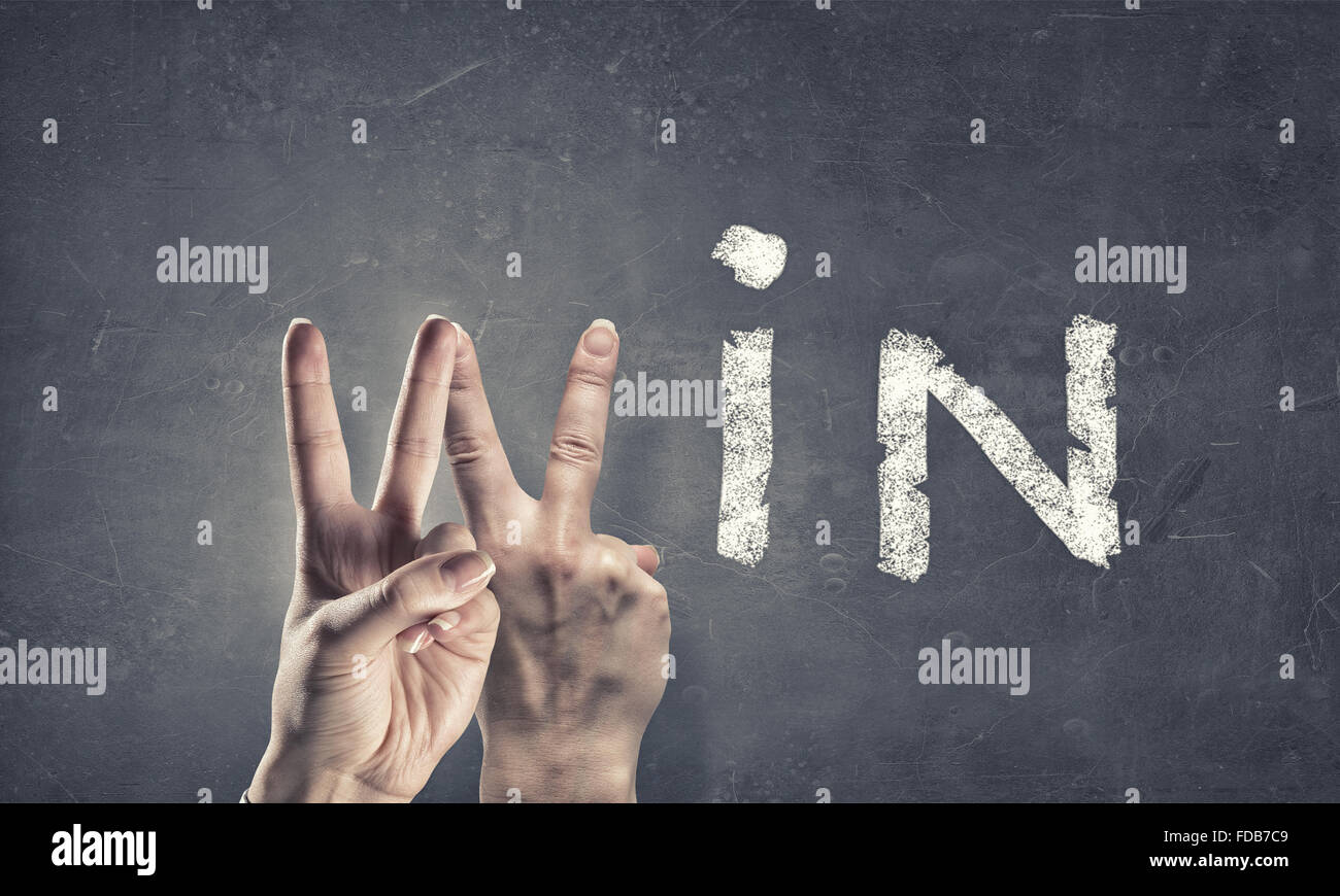 Word WIN with fingers instead of letter W Stock Photo - Alamy