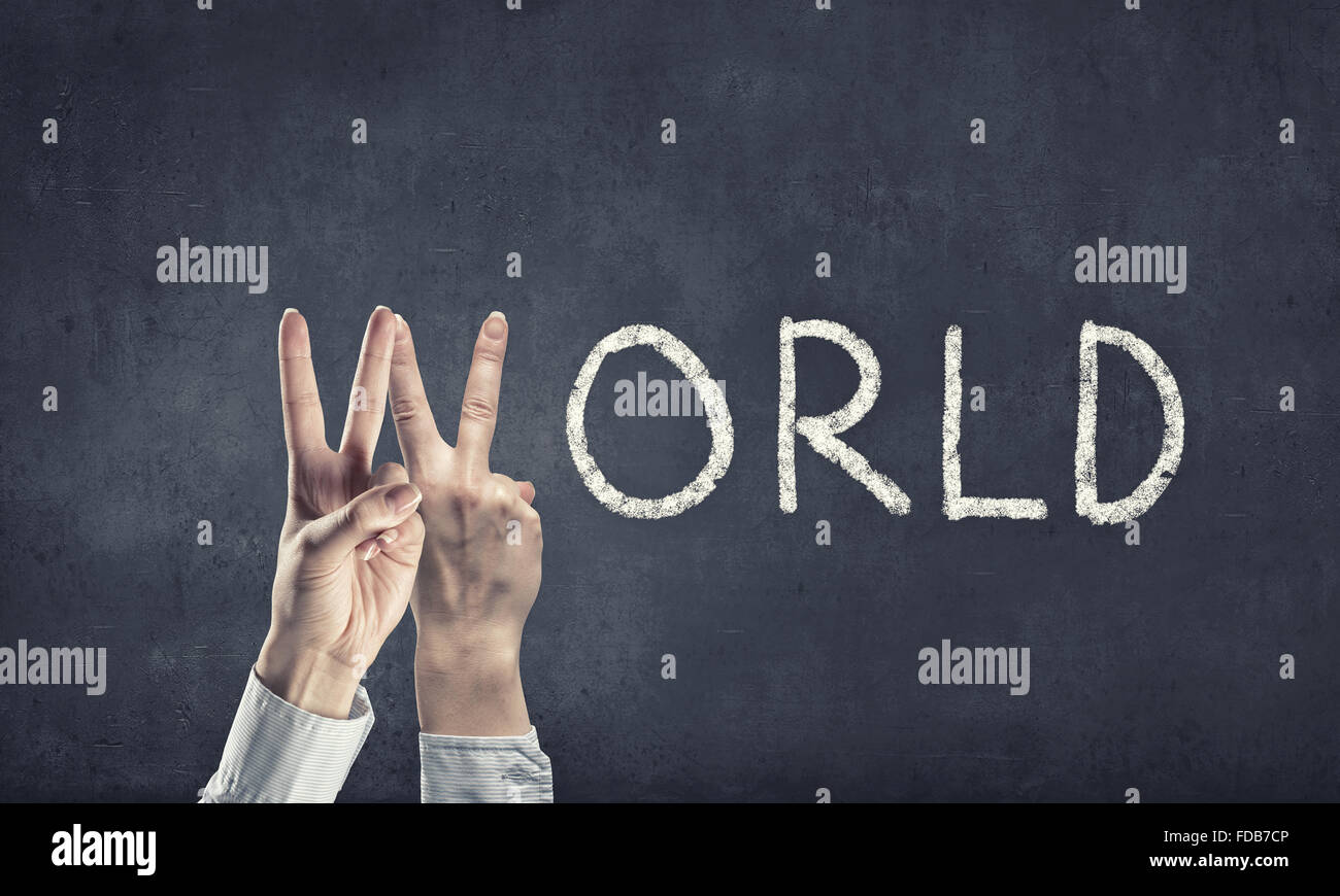 Word world with fingers instead of letter W Stock Photo - Alamy