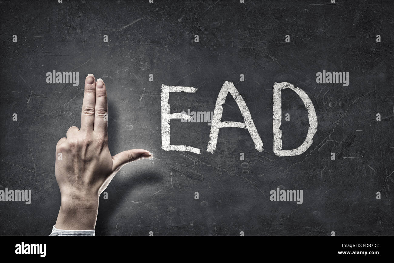 Word lead written on wall and fingers instead of letter L Stock Photo ...