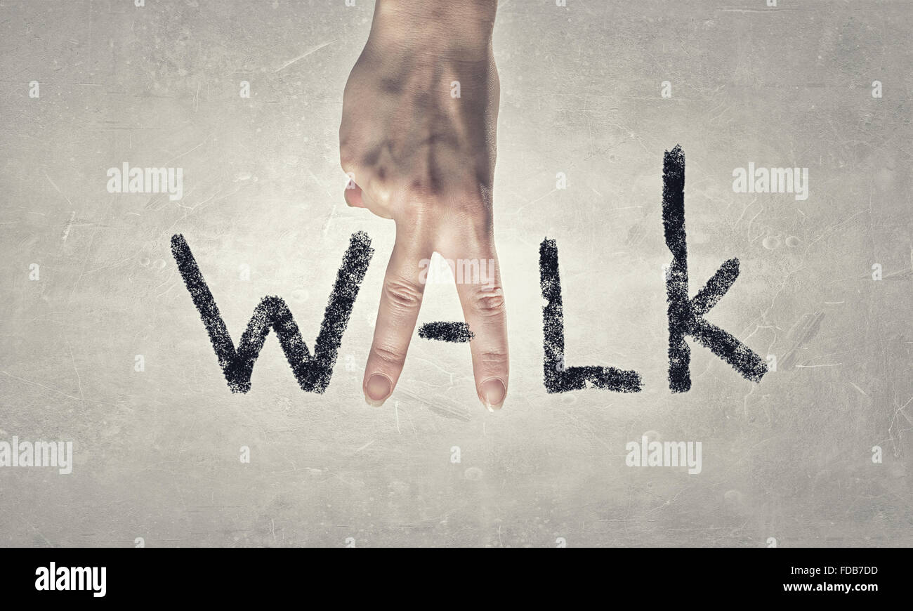 Word walk and fingers instead of letter A Stock Photo - Alamy