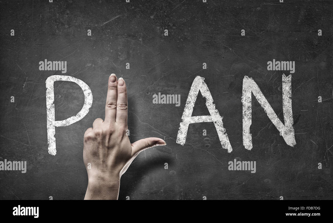 Close up of hands making letter in word plan Stock Photo - Alamy