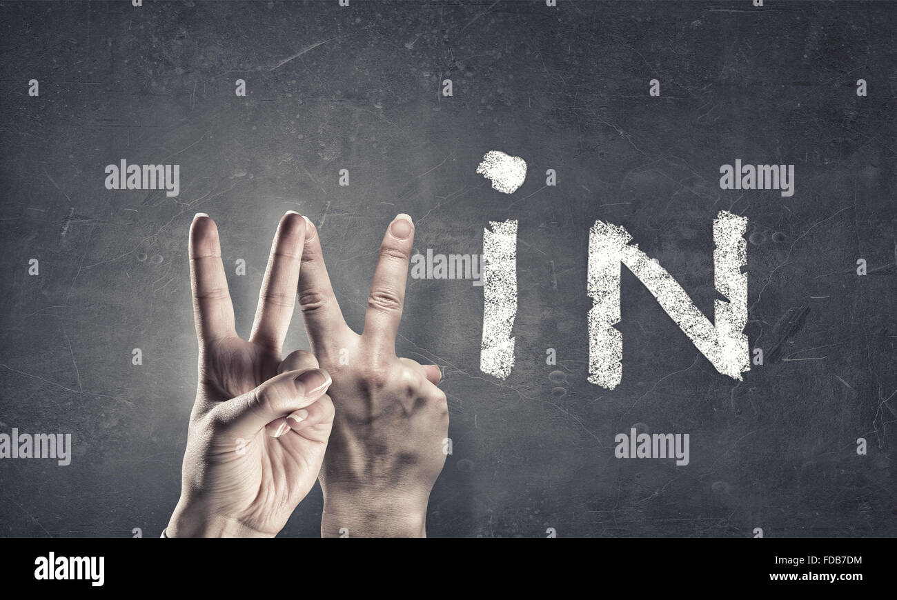 Word WIN with fingers instead of letter W Stock Photo - Alamy