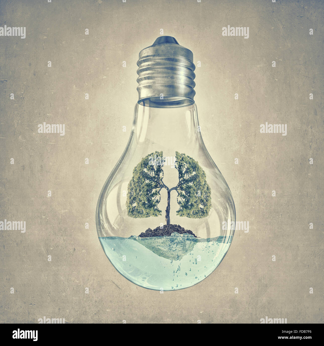 Glass lightbulb with green tree growing inside Stock Photo - Alamy