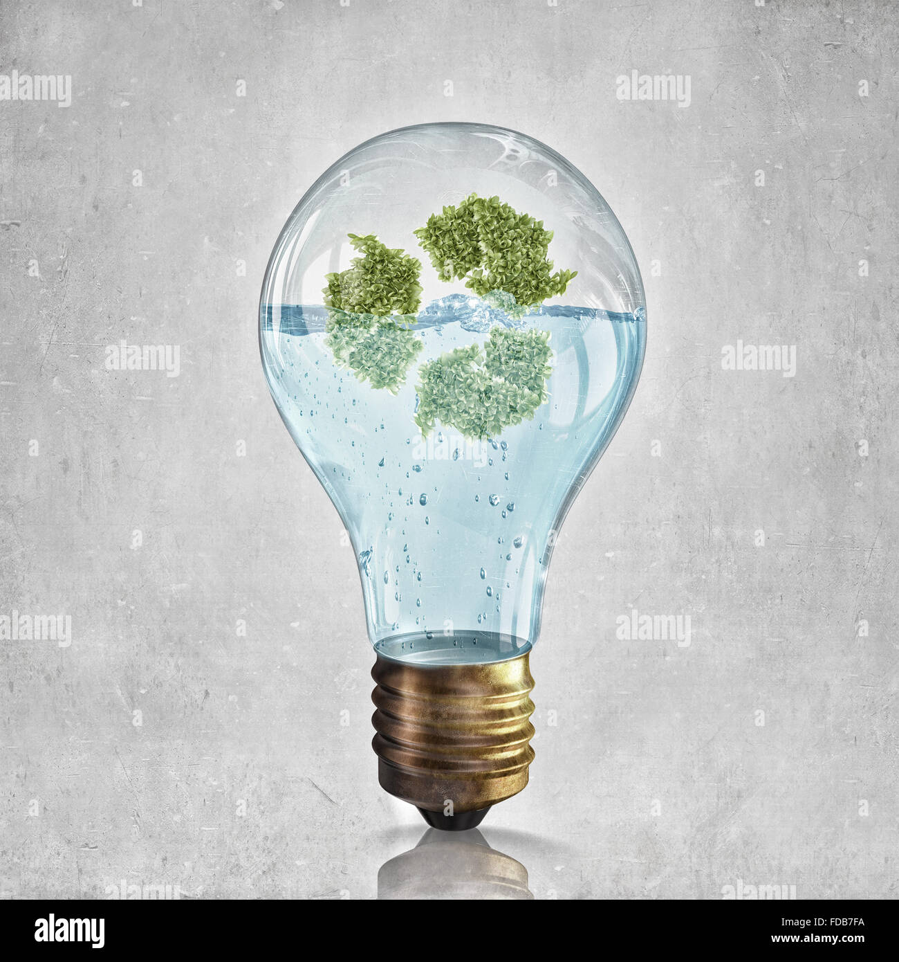 Glass lightbulb with green recycle symbol growing inside Stock Photo ...