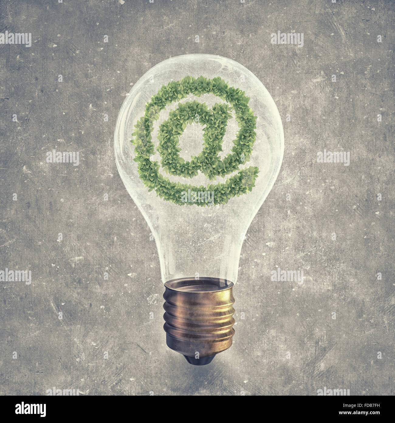 Green email symbol inside glass light bulb Stock Photo - Alamy