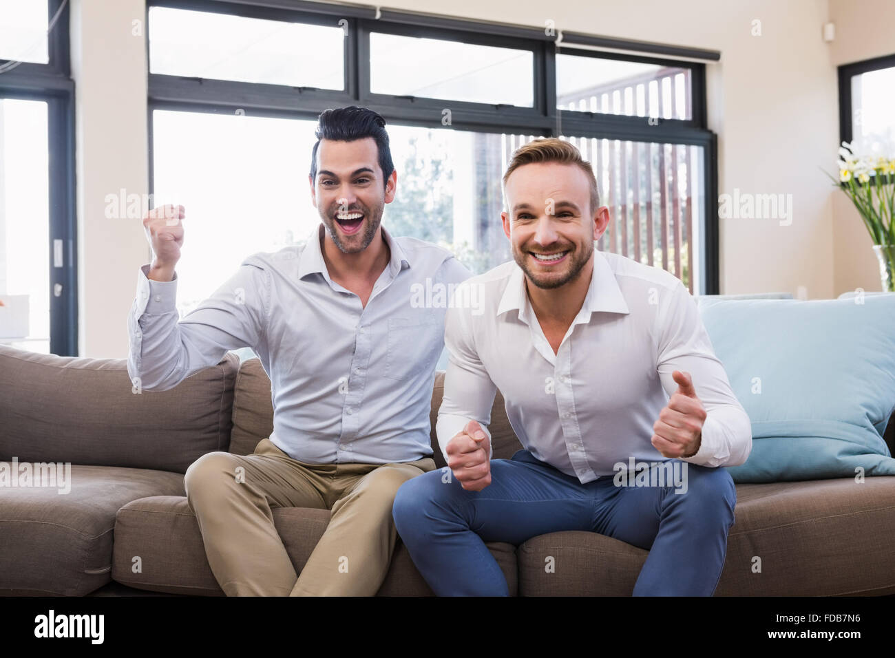 Handsome man celebrating victory Stock Photo - Alamy