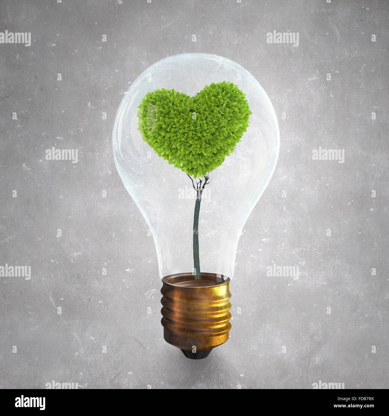 Glass lightbulb with love shaped green tree growing inside Stock Photo ...