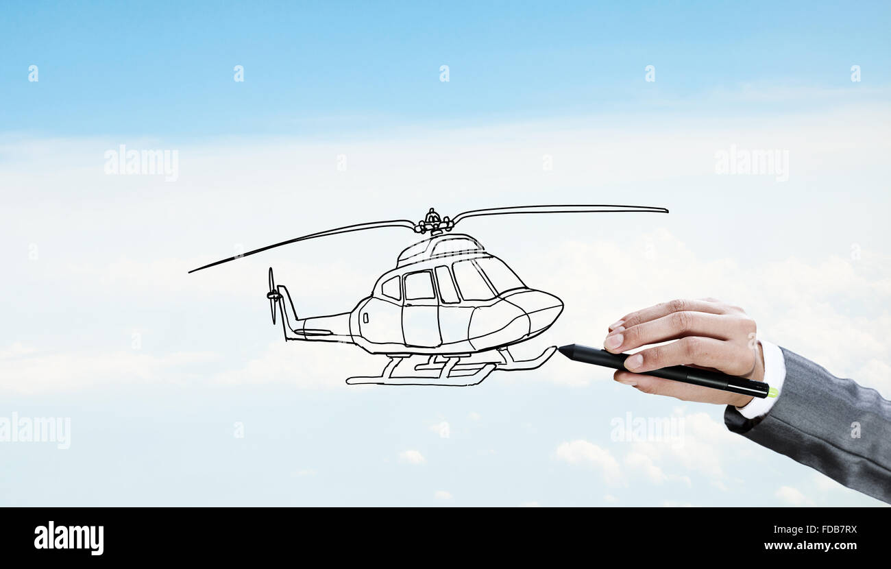 Hand drawing with stylus helicopter model on sky background Stock Photo ...