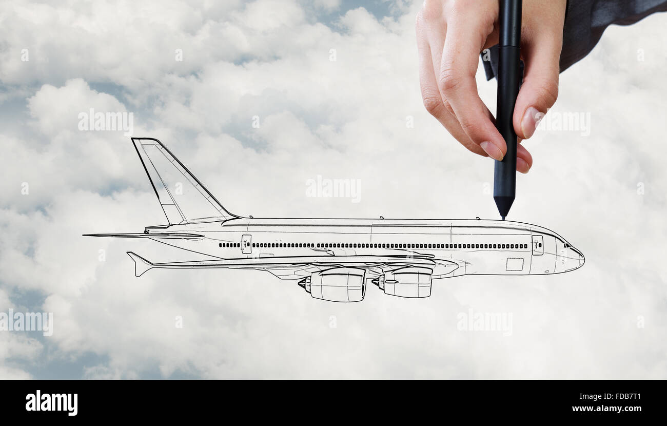 Person drawing airplane model on sky background Stock Photo - Alamy