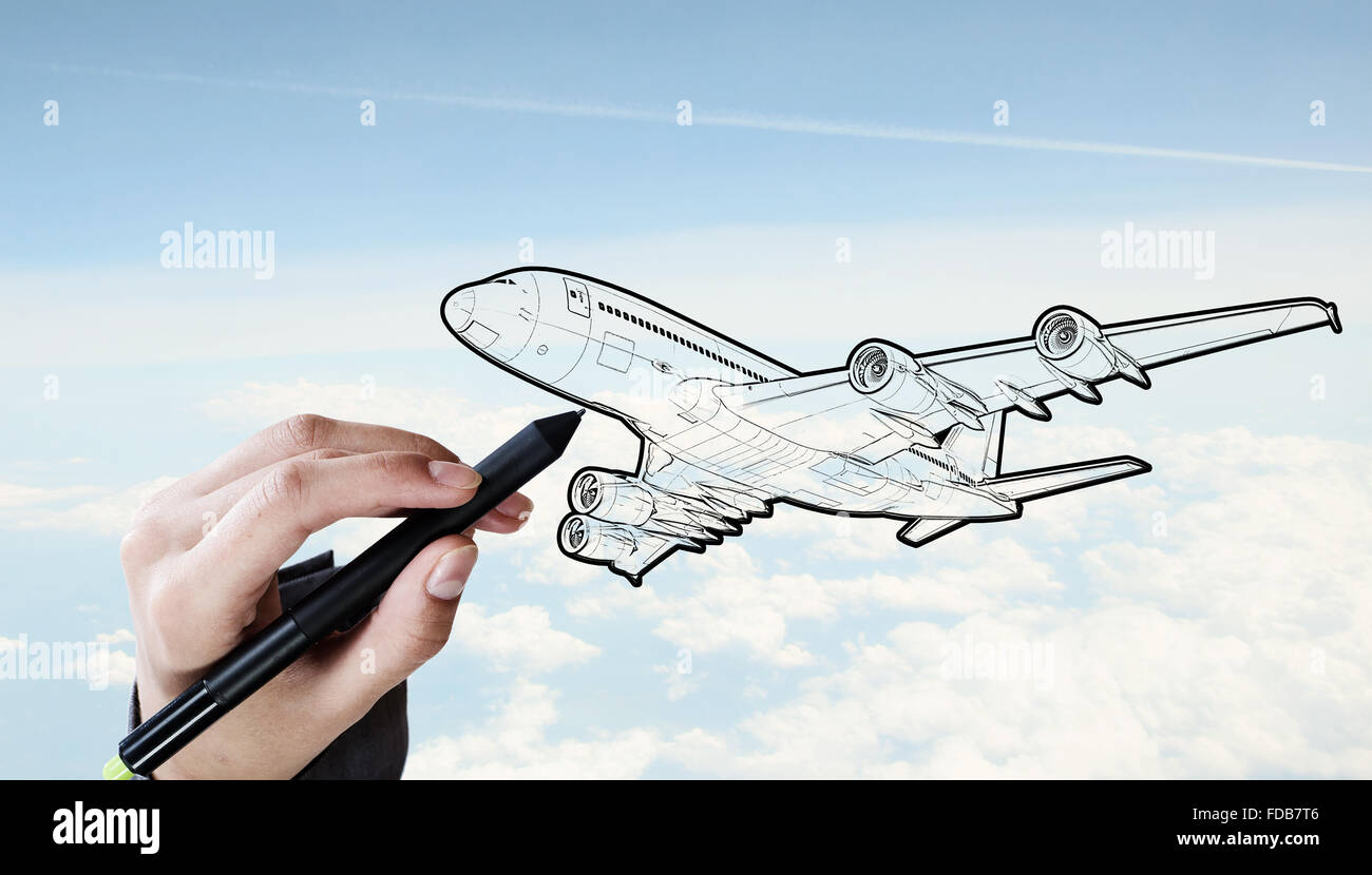 Person drawing airplane model on sky background Stock Photo - Alamy