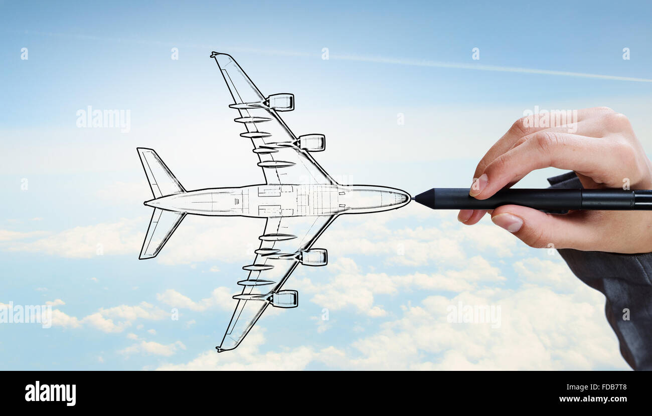 Person drawing airplane model on sky background Stock Photo - Alamy