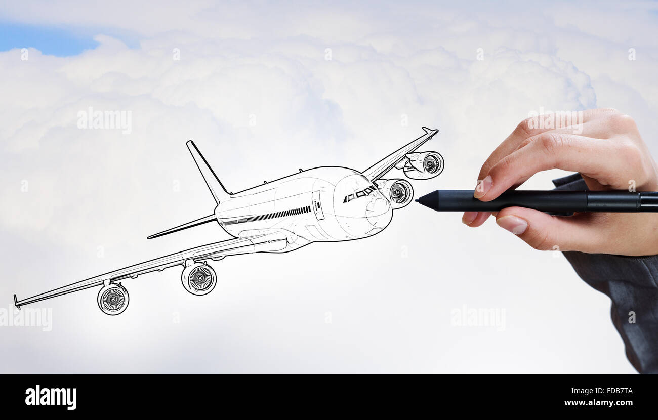 Person drawing airplane model on sky background Stock Photo - Alamy
