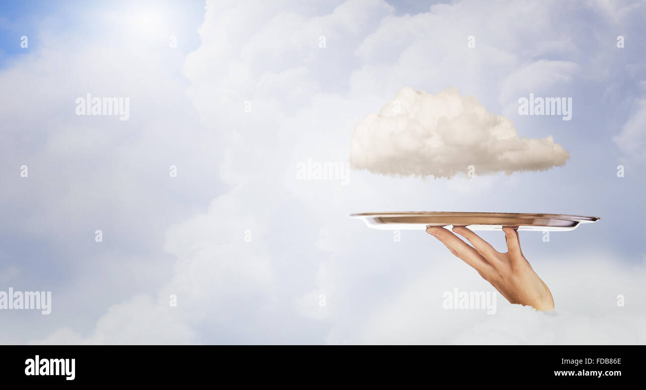 Human hand holding metal tray with cloud Stock Photo - Alamy