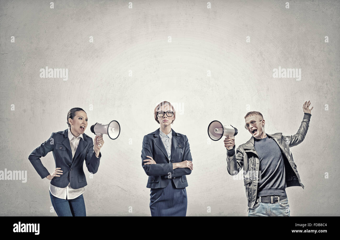 Aggressive people screaming in megaphone on each other Stock Photo - Alamy