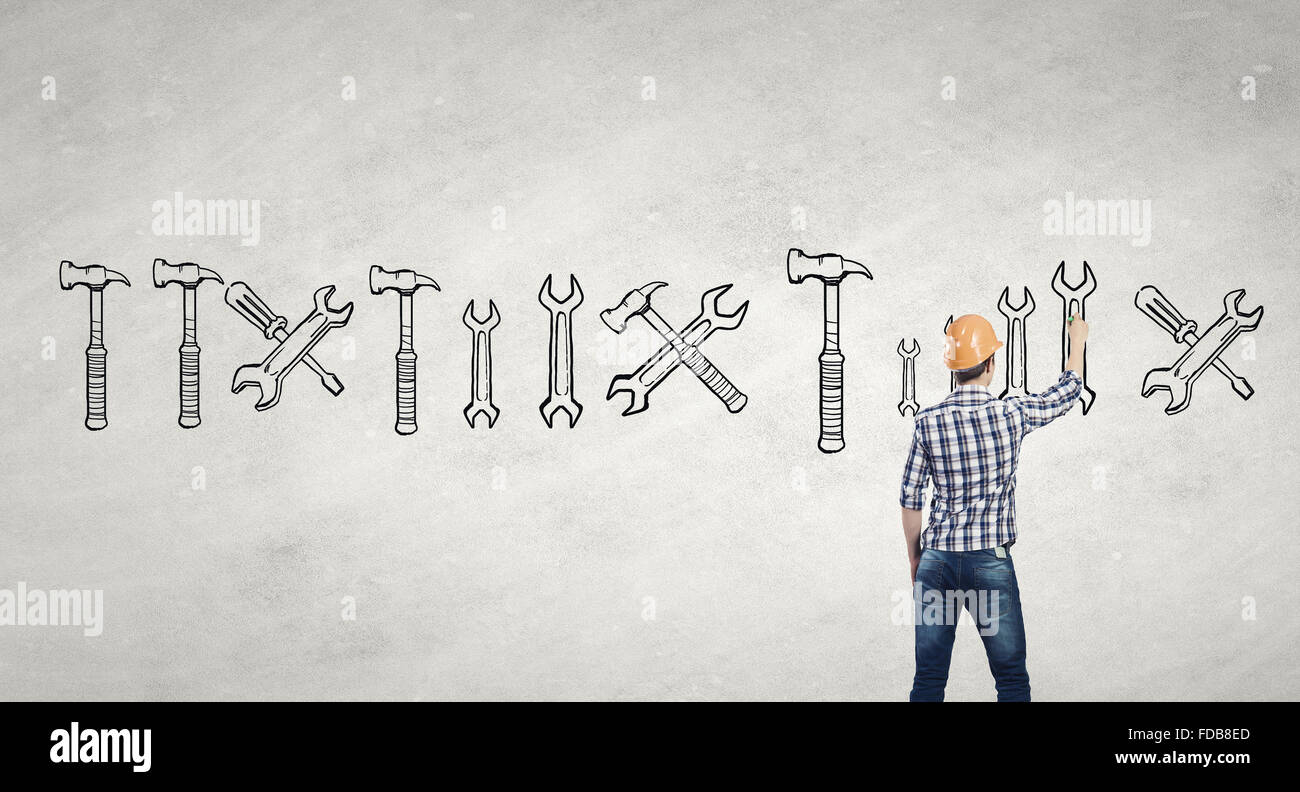 Rear view of engineer drawing instruments on wall Stock Photo - Alamy