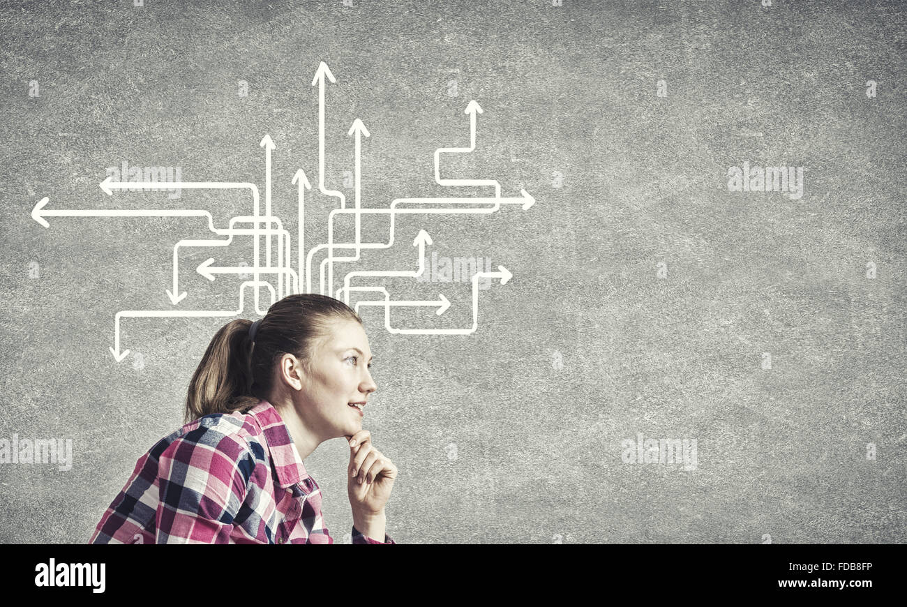 Pretty young woman making decision with arrows above her head Stock ...