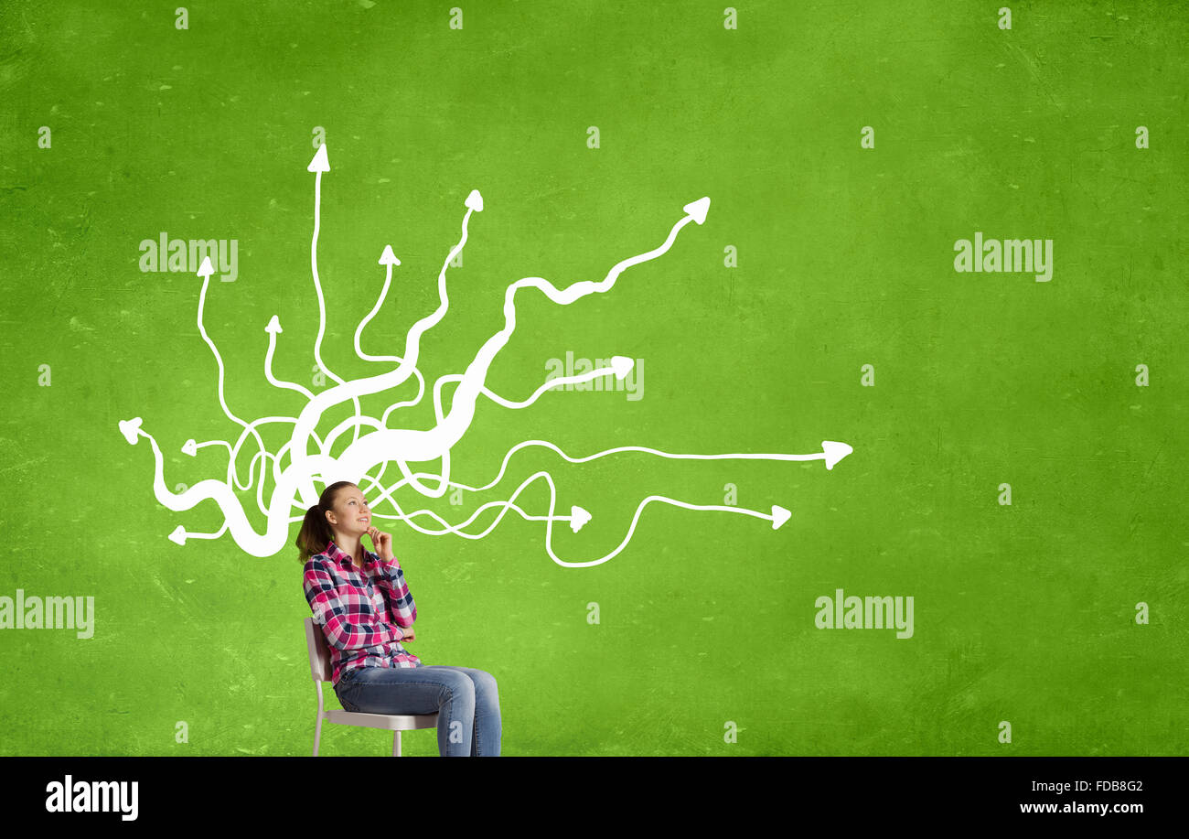Pretty young woman making decision with arrows above her head Stock ...