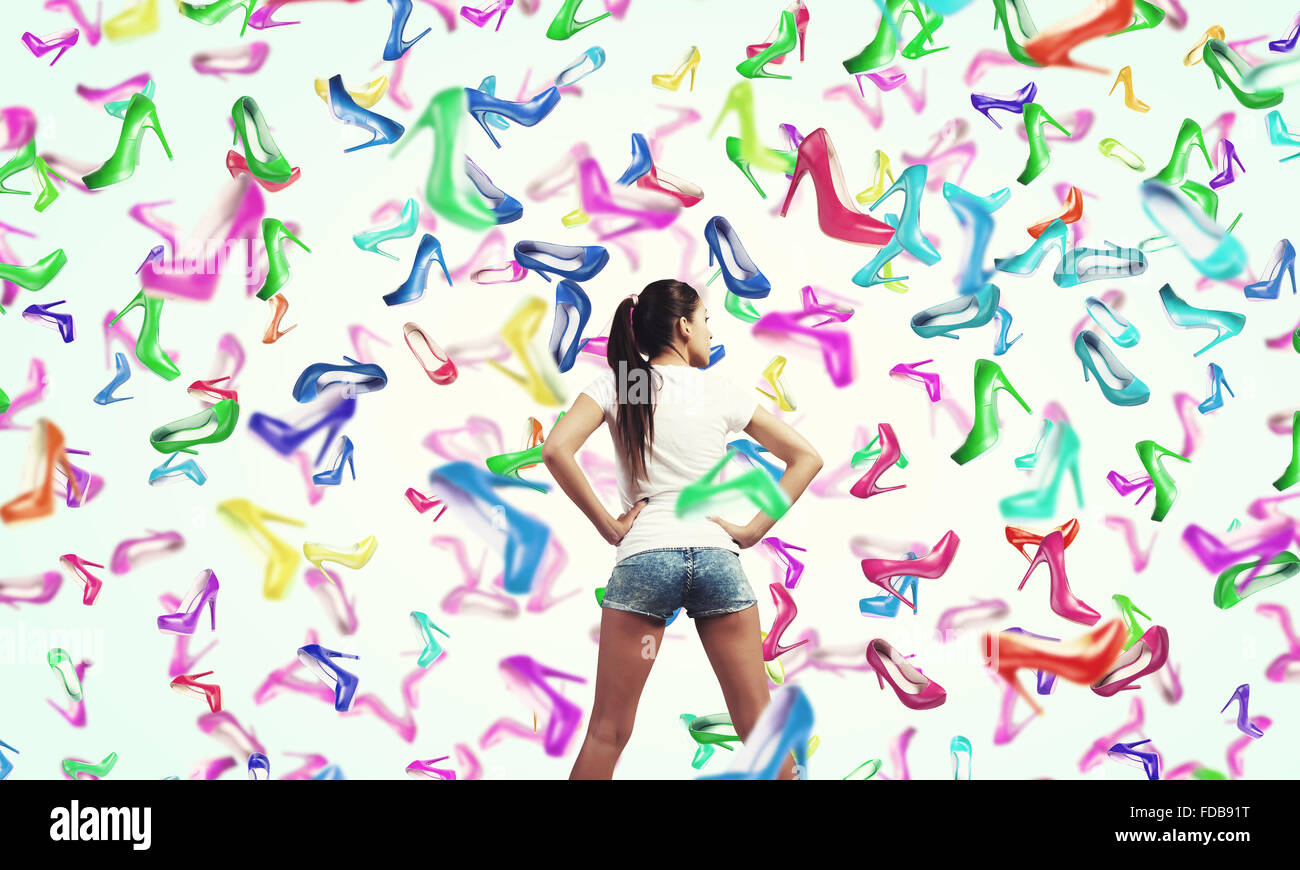 Beautiful young woman in shorts and falling shoes Stock Photo - Alamy