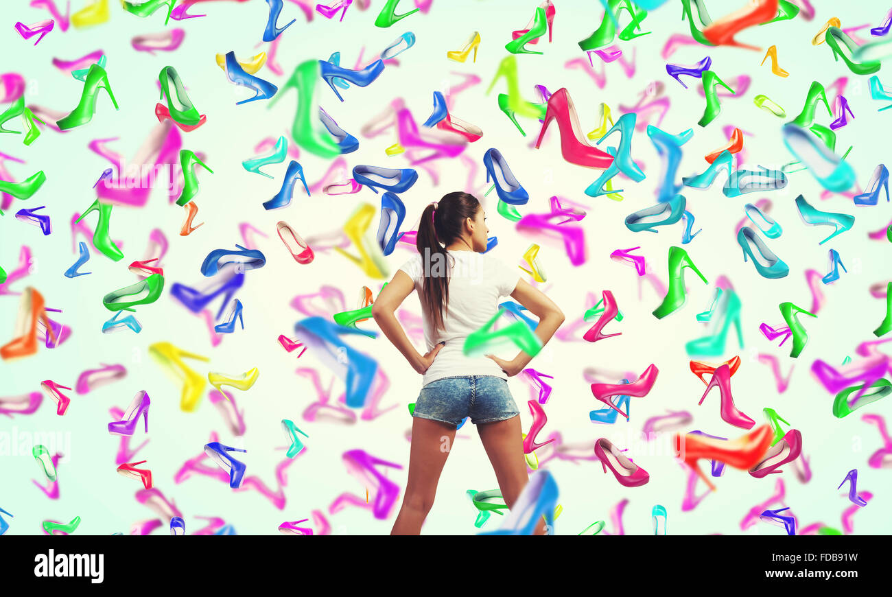 Beautiful young woman in shorts and falling shoes Stock Photo - Alamy