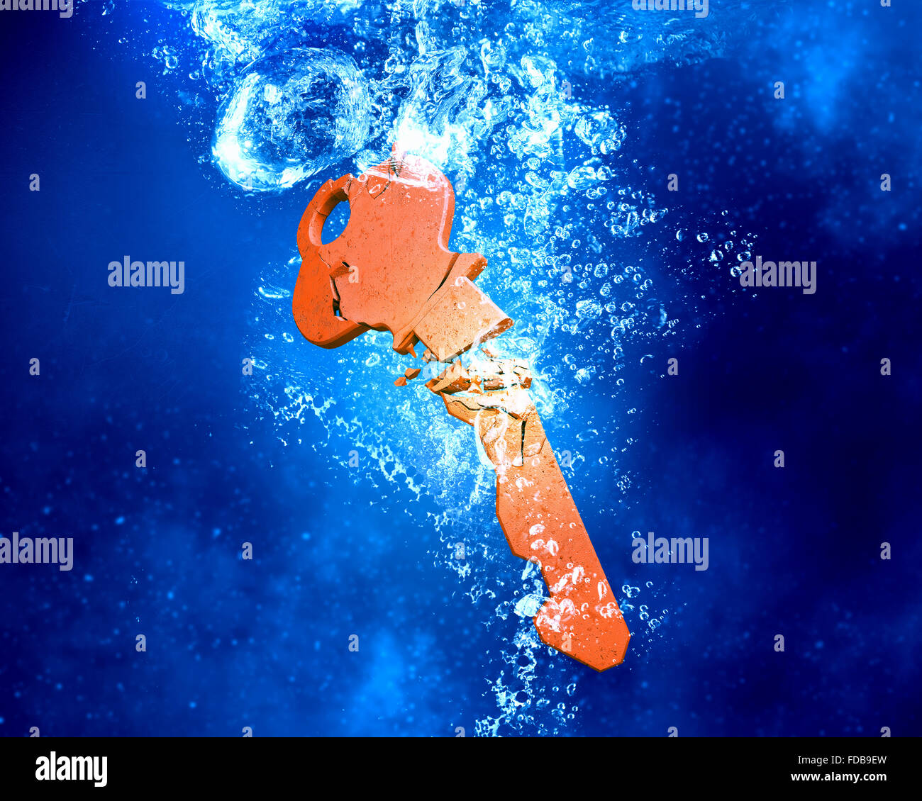 Key sinking and dissolving in clear blue water Stock Photo - Alamy