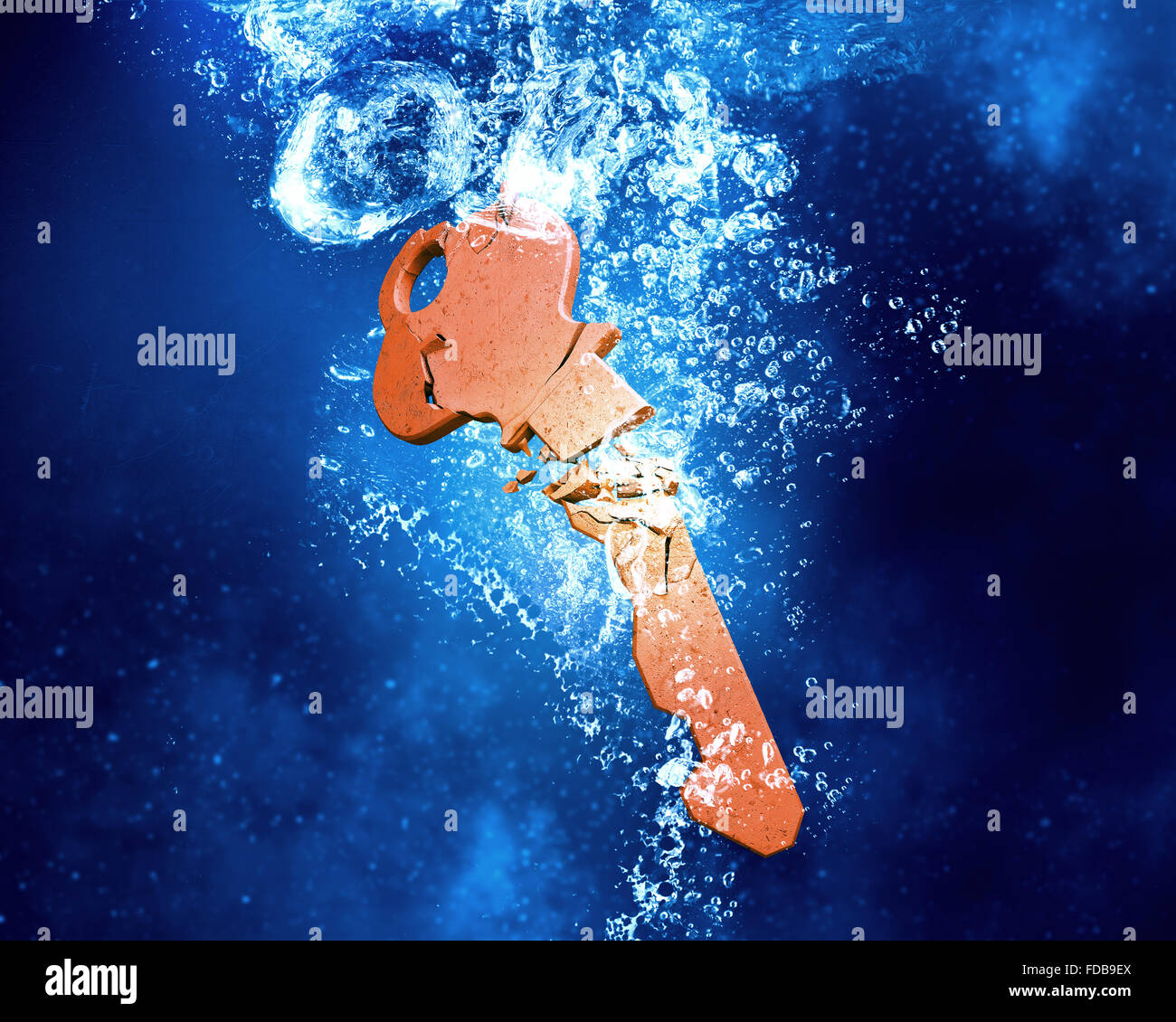 Key sinking and dissolving in clear blue water Stock Photo - Alamy