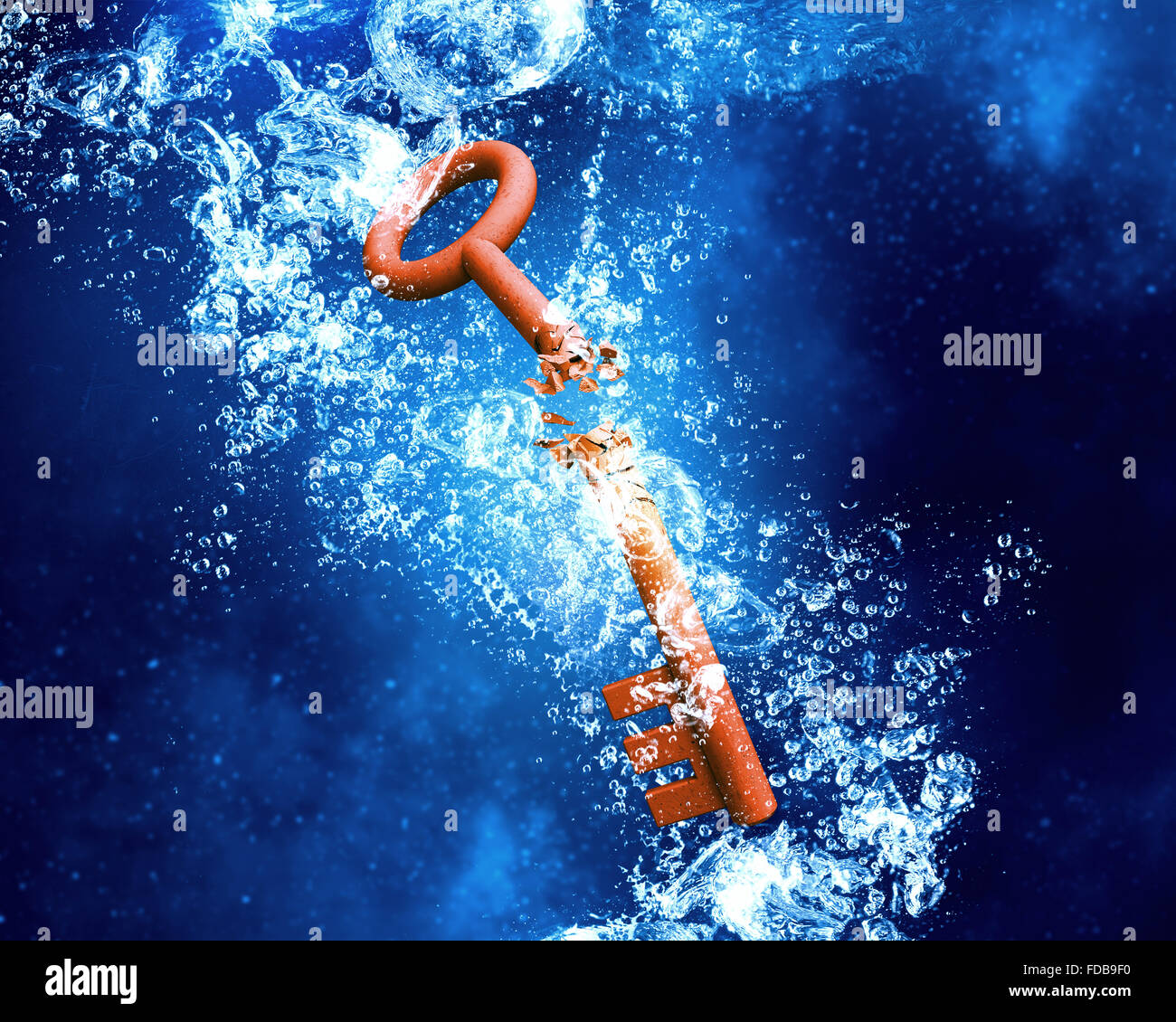 Key sinking and dissolving in clear blue water Stock Photo - Alamy