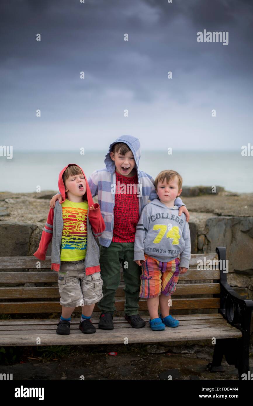 Three Boys On A Bench High Resolution Stock Photography and Images - Alamy